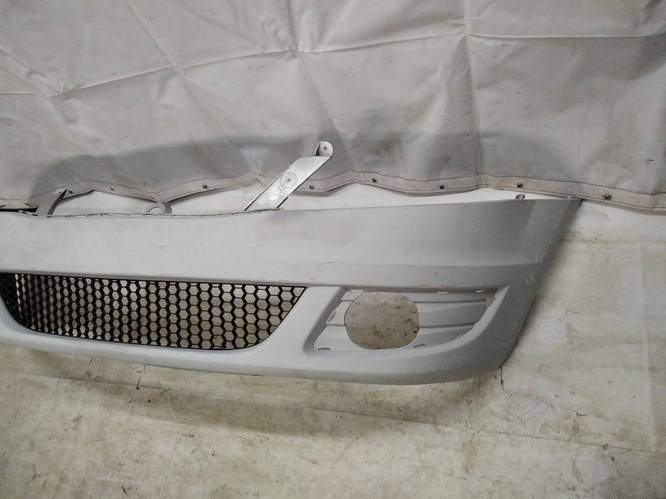 Купити Бампер передній Dacia Logan (2008-2012) Оригінал з гратами є ...