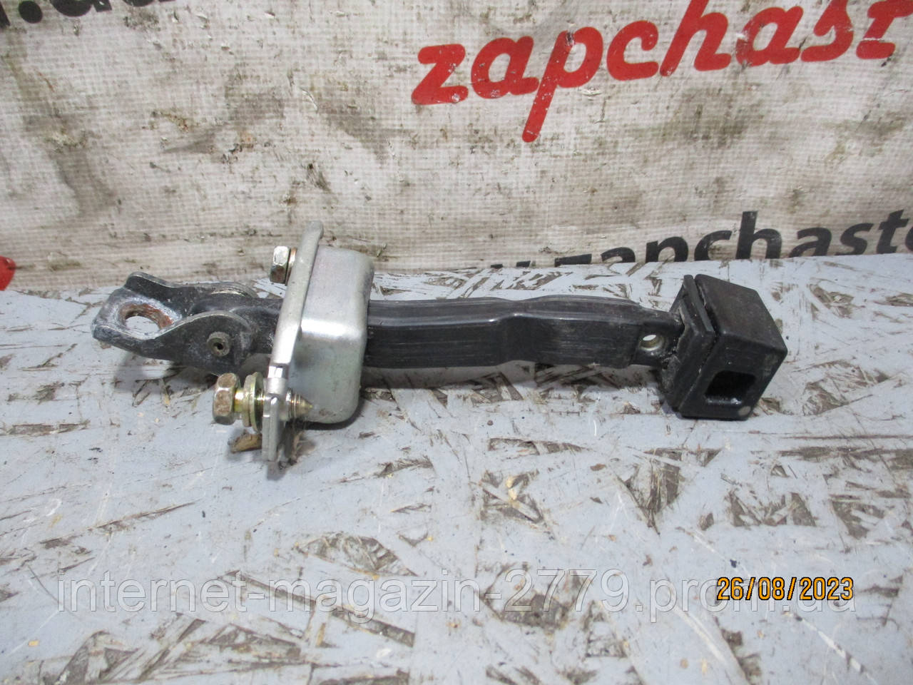 Обмежувач / фіксатор двері передньої лів=прав 5702A079, 5702A040 ...