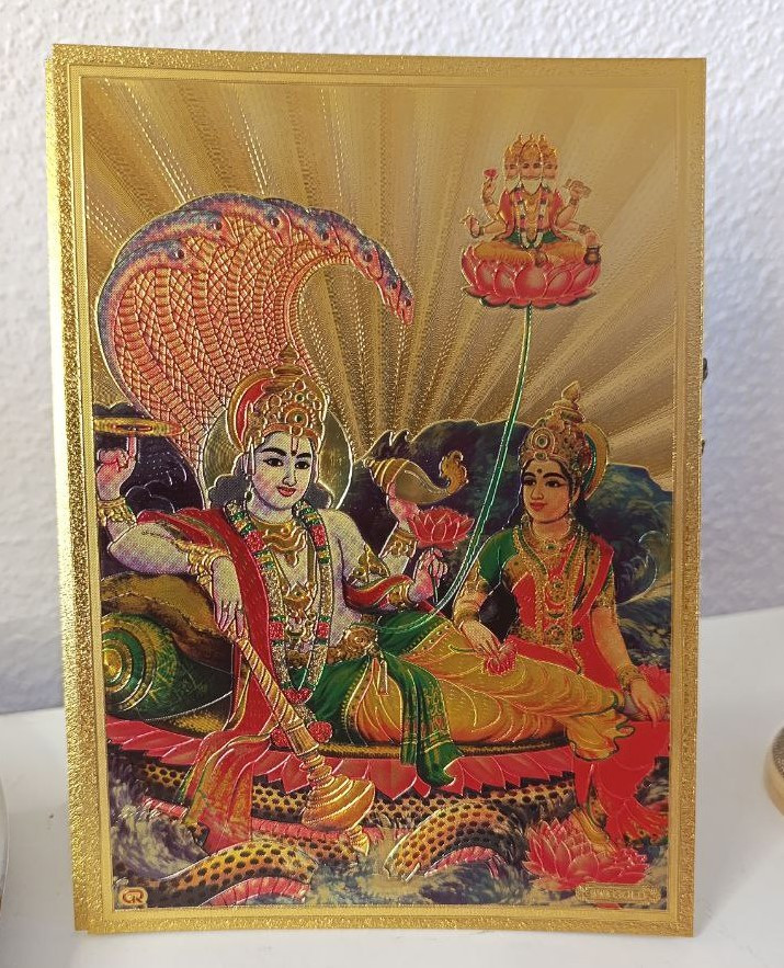 Зображення Вішну та Лакшмі з Брахмою в лотосі на змії Шеша символи захисту процвітання та