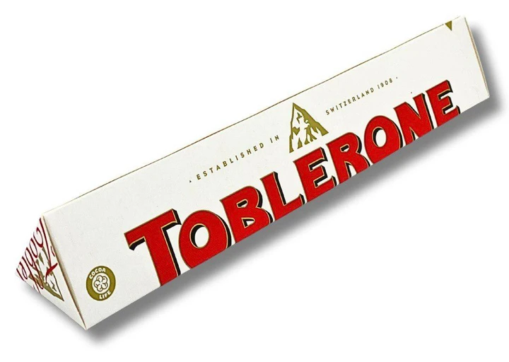 Шоколад білий Toblerone White Chocolane Almond Nougat з медово ...